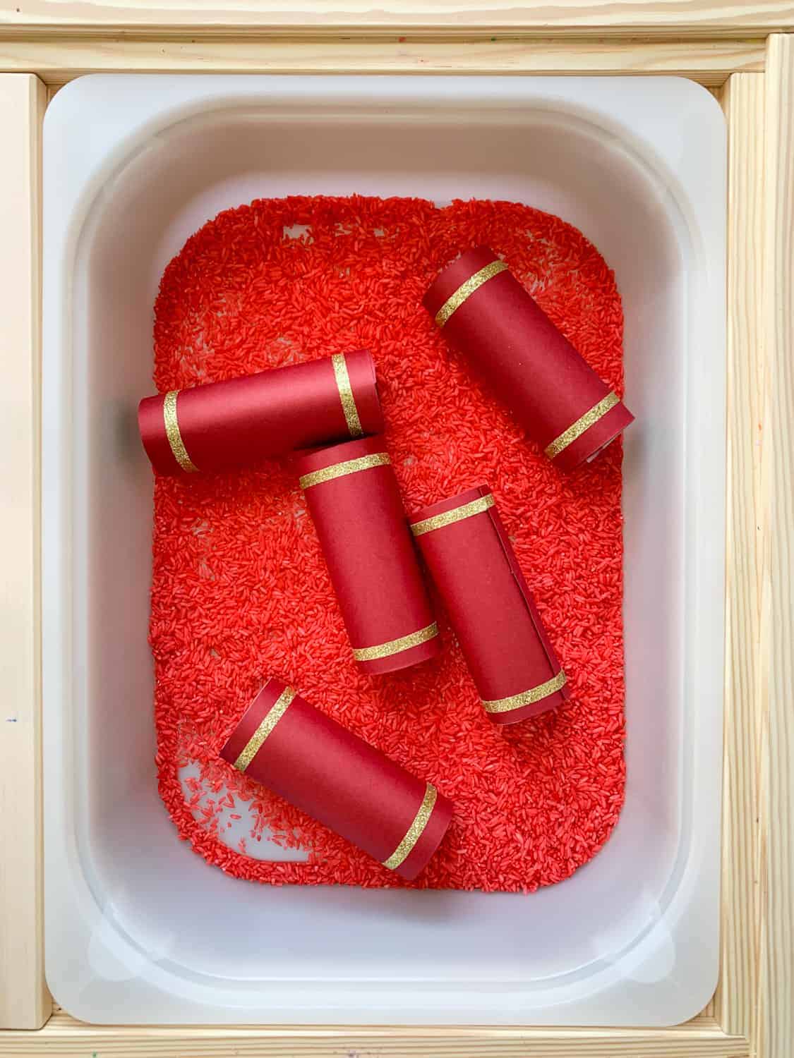 Chinese New Year Firecrackers Sensory Bin - Discovering Mommyhood